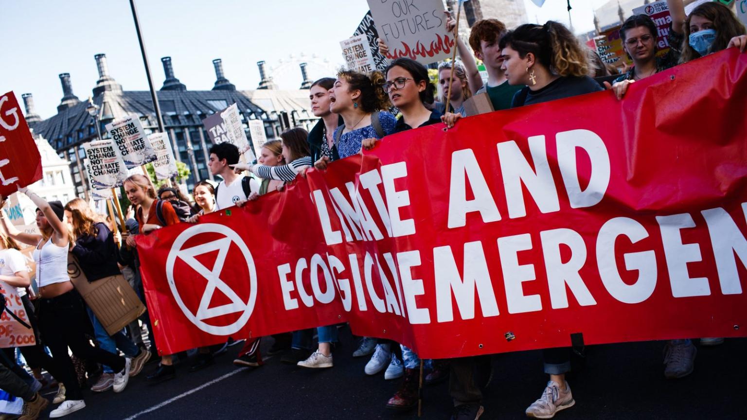 The story behind the Extinction Rebellion symbol at climate protests ...
